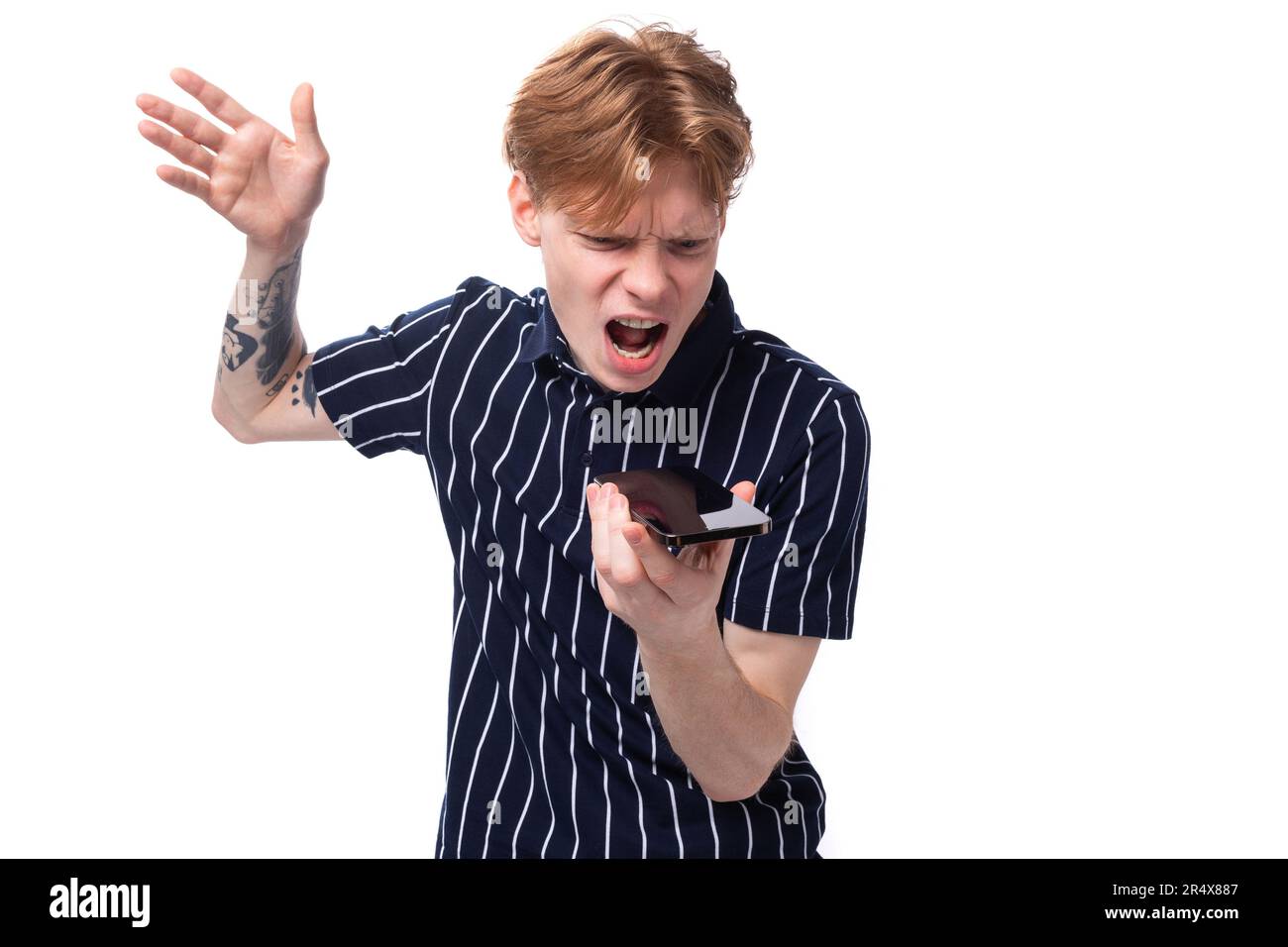 stylish young white-haired man screaming into the phone Stock Photo - Alamy