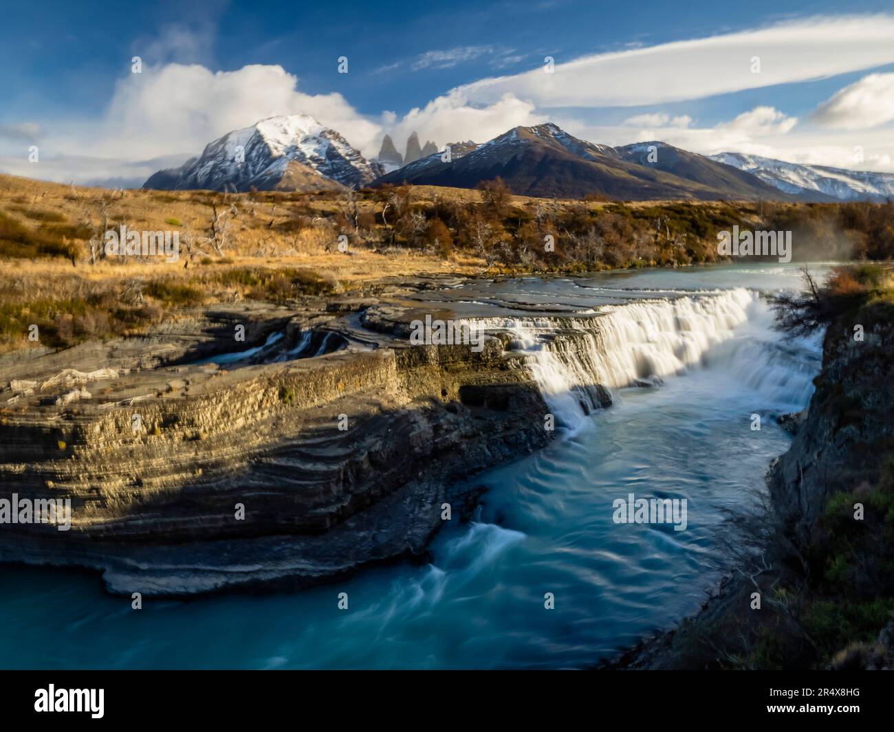 Scenic view of Cascada Rio Paine with the Cuernos Del Paine mountain ...