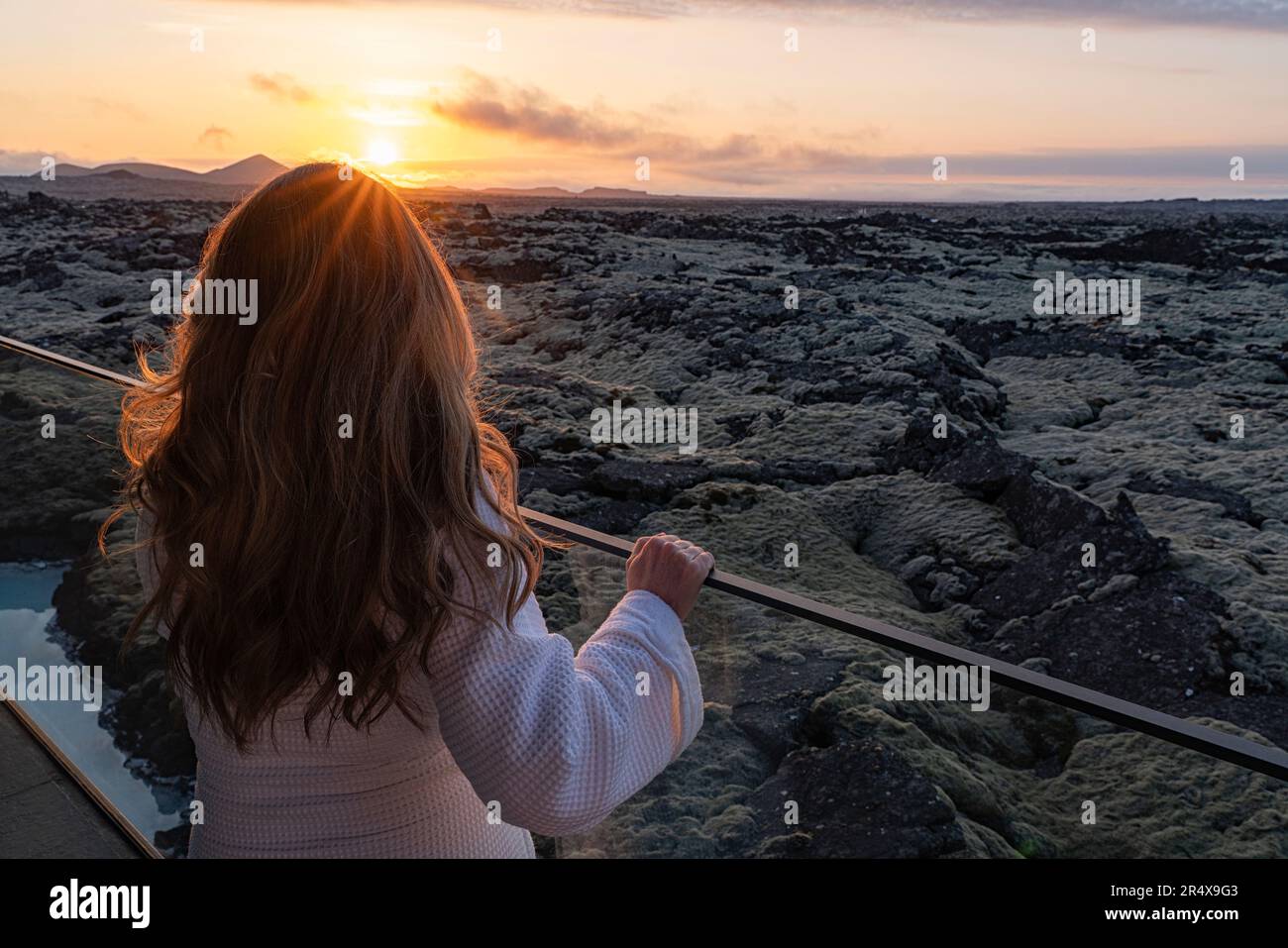 Woman backlit balcony rear view hi-res stock photography and images - Alamy