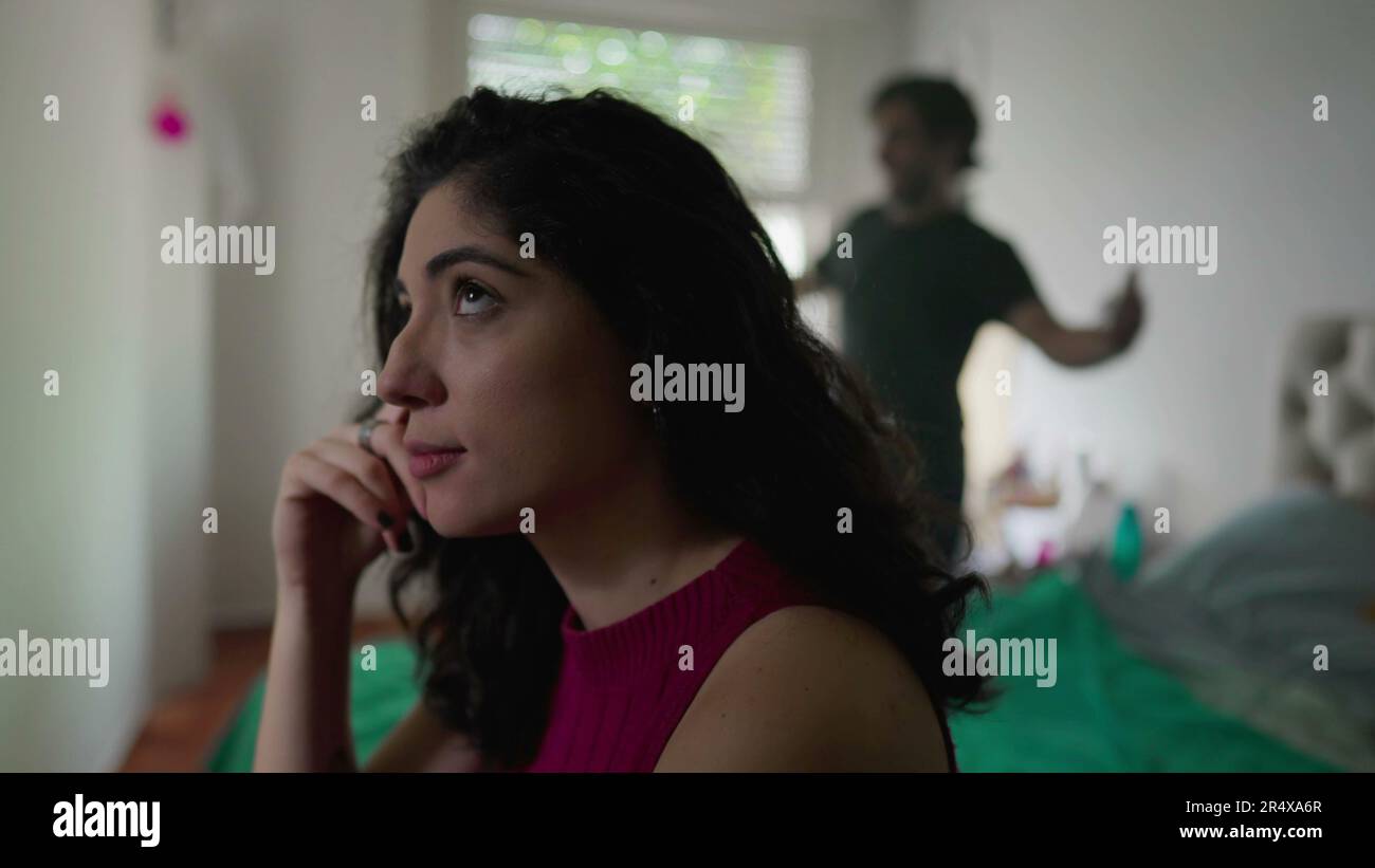 Couple in crisis Young woman rolling eyes listening to male partner ...