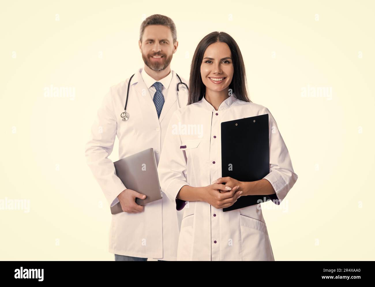 selective focus of doctor and internist isolated on white background ...