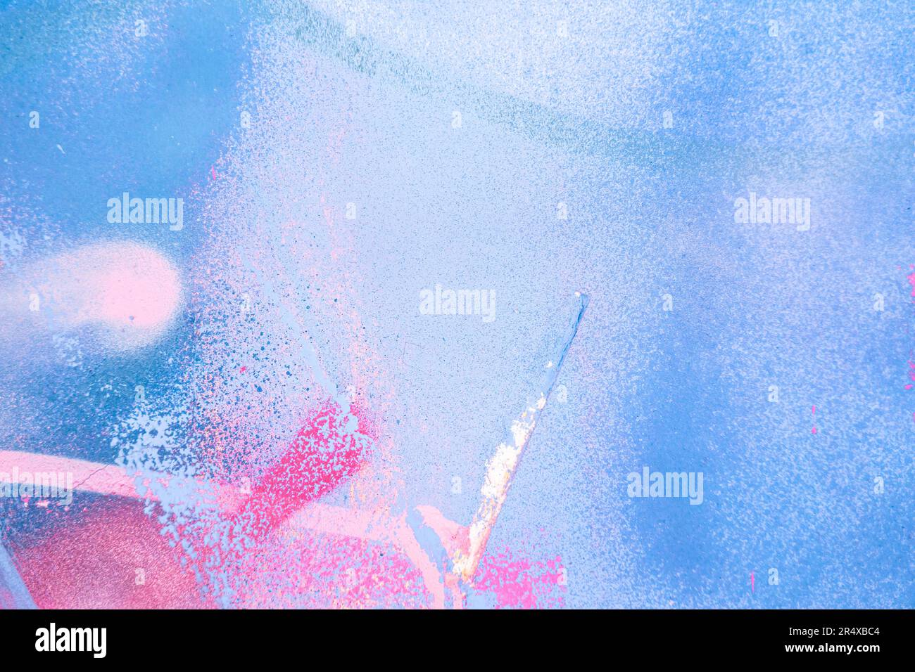 Messy paint strokes and smudges on an old painted wall. Purple, blue ...