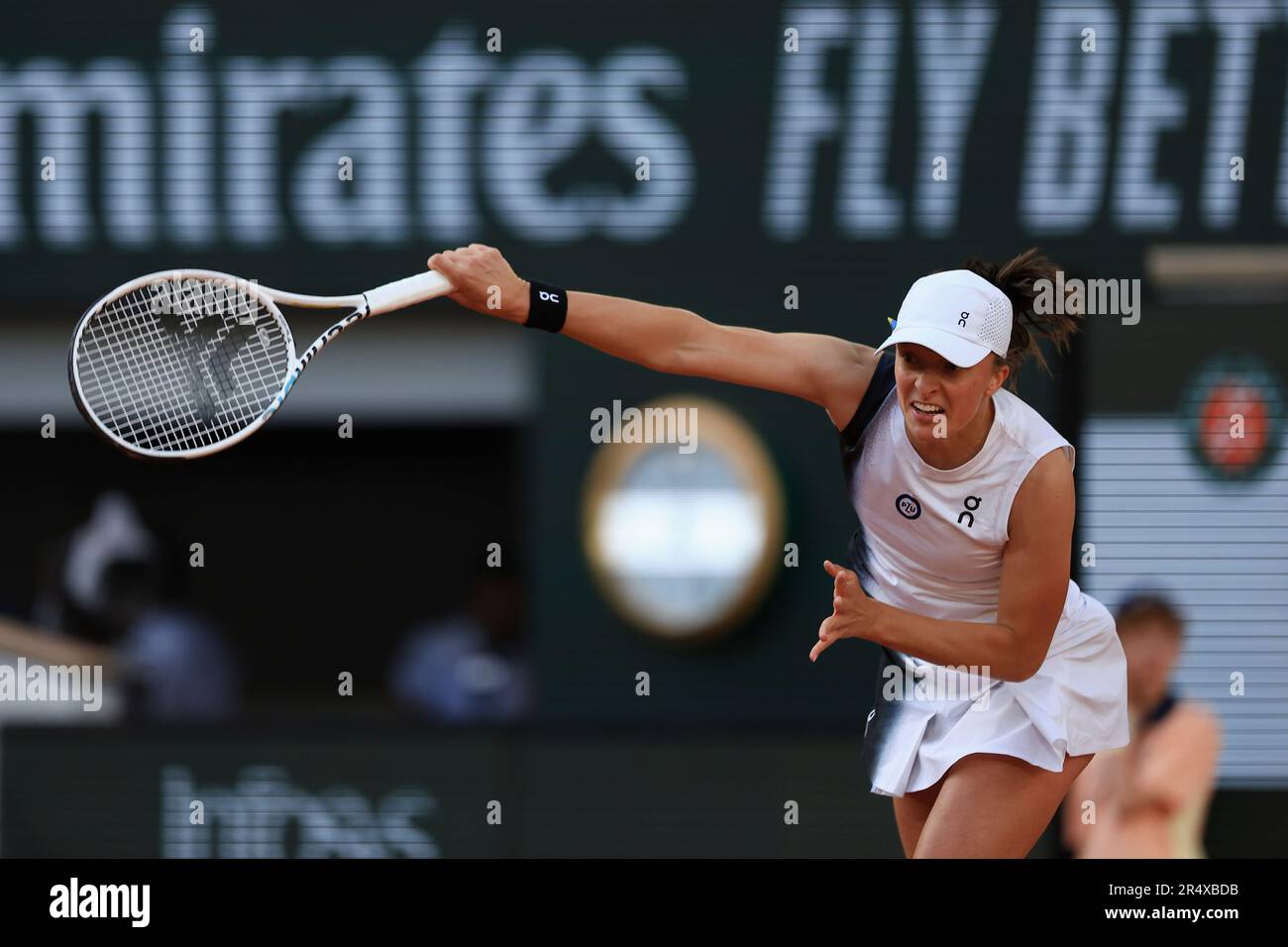 Poland's Iga Swiatek serves against Spain's Cristina Bucsa during their first round match of the ...