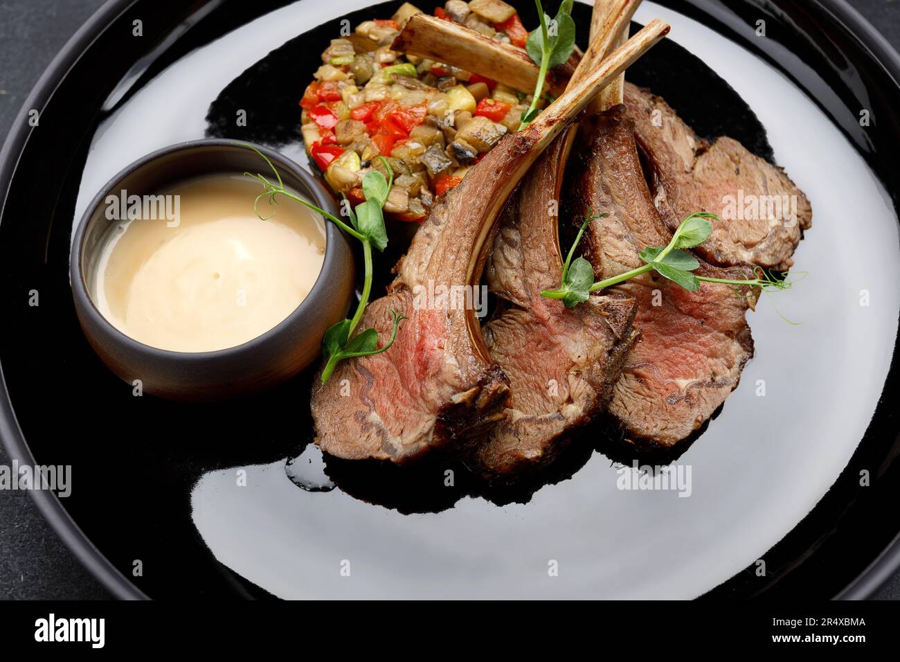 grilled ribs with vegetable salad and sauce Stock Photo - Alamy