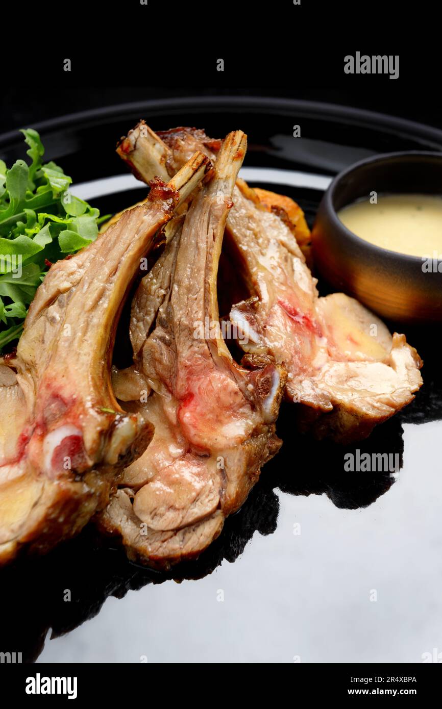 grilled ribs with vegetable salad and sauce Stock Photo - Alamy
