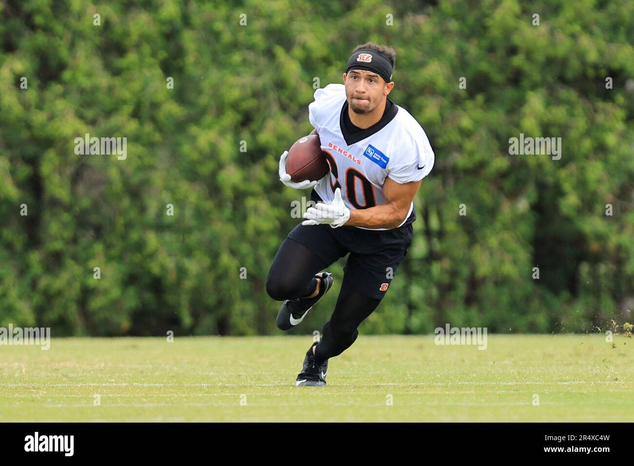Cincinnati Bengals' Chase Brown carries the ball in a drill during a ...