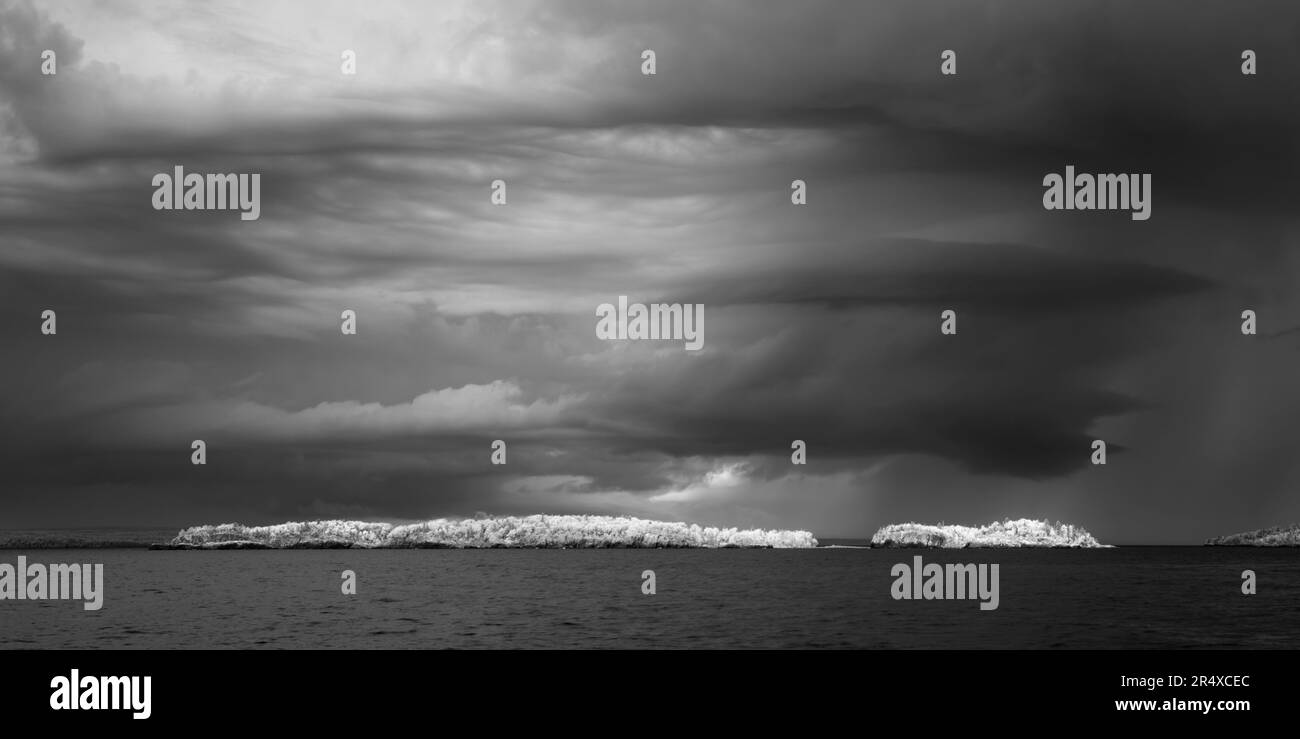 Dramatic cloud formation over rocks in Lake Superior in infrared ...