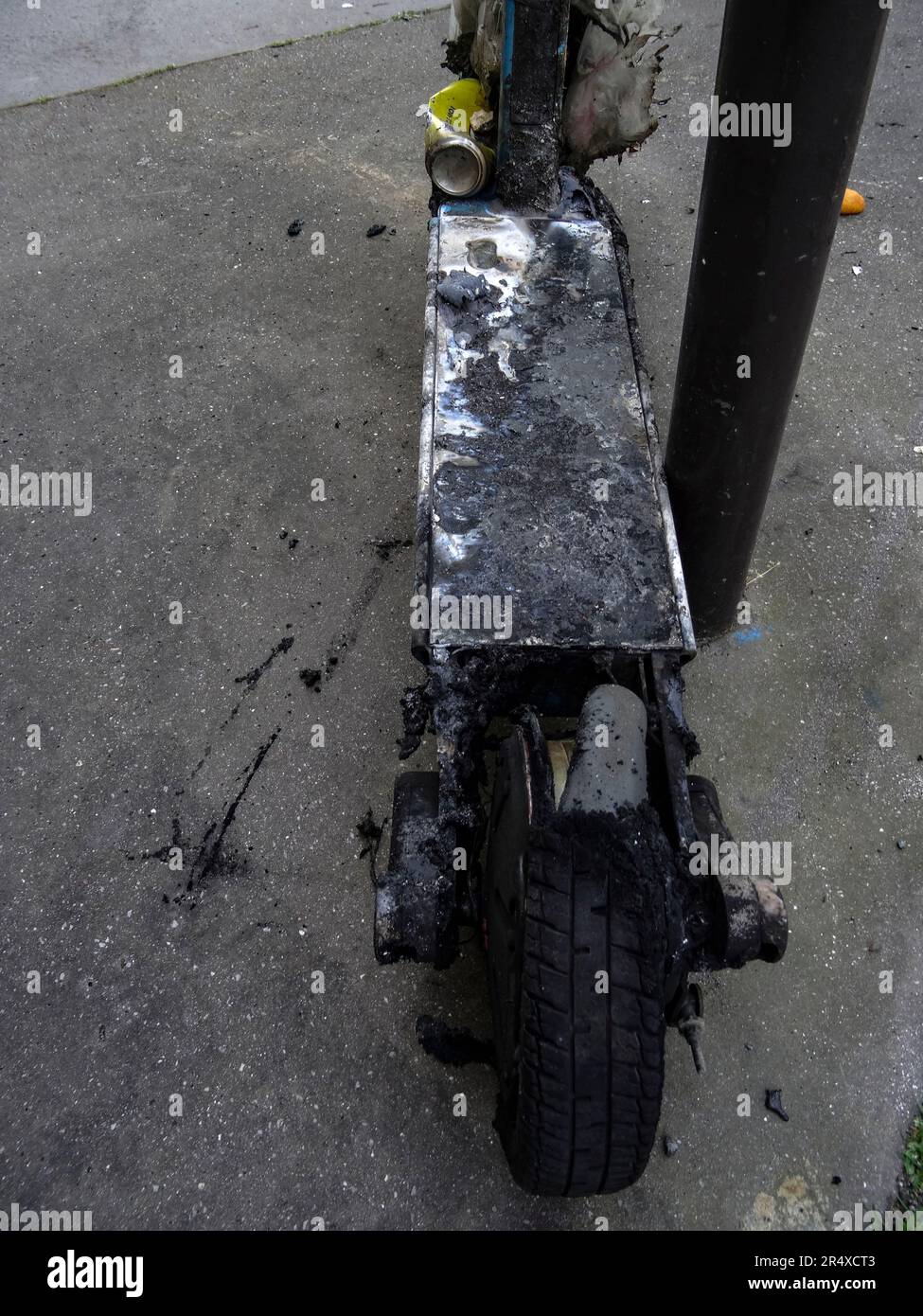 Burnt out electric scooter on Paris street, Nation, France Stock Photo ...