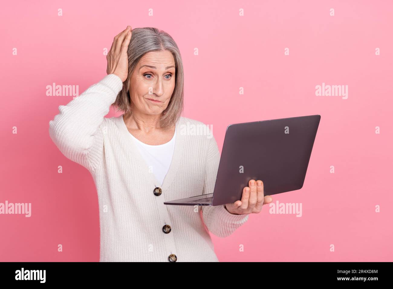 Full length photo of lovely retired lady confused disappointed netbook ...