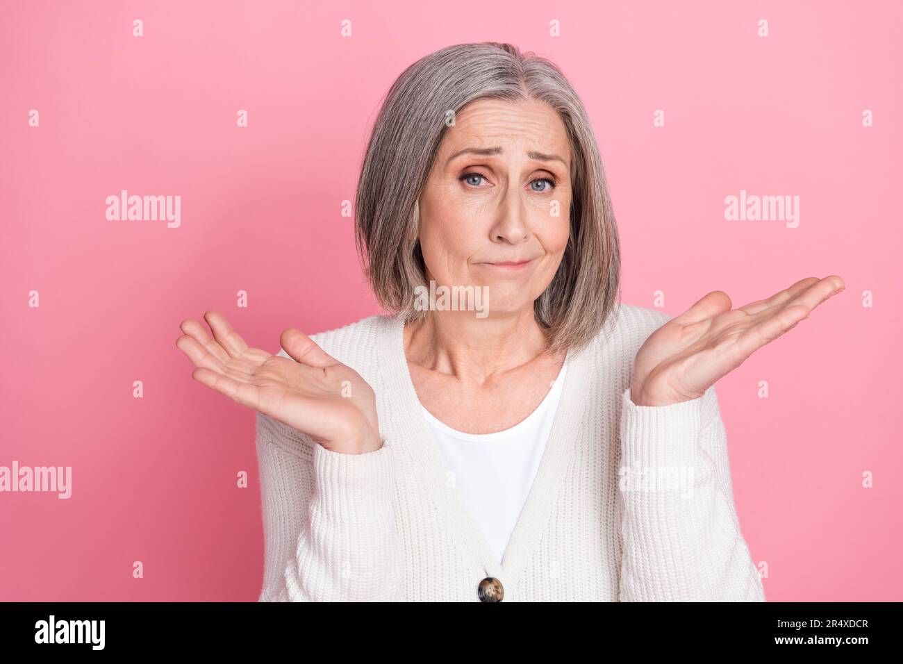 Photo of careless aged person raise arms palms shrug shoulders have no ...