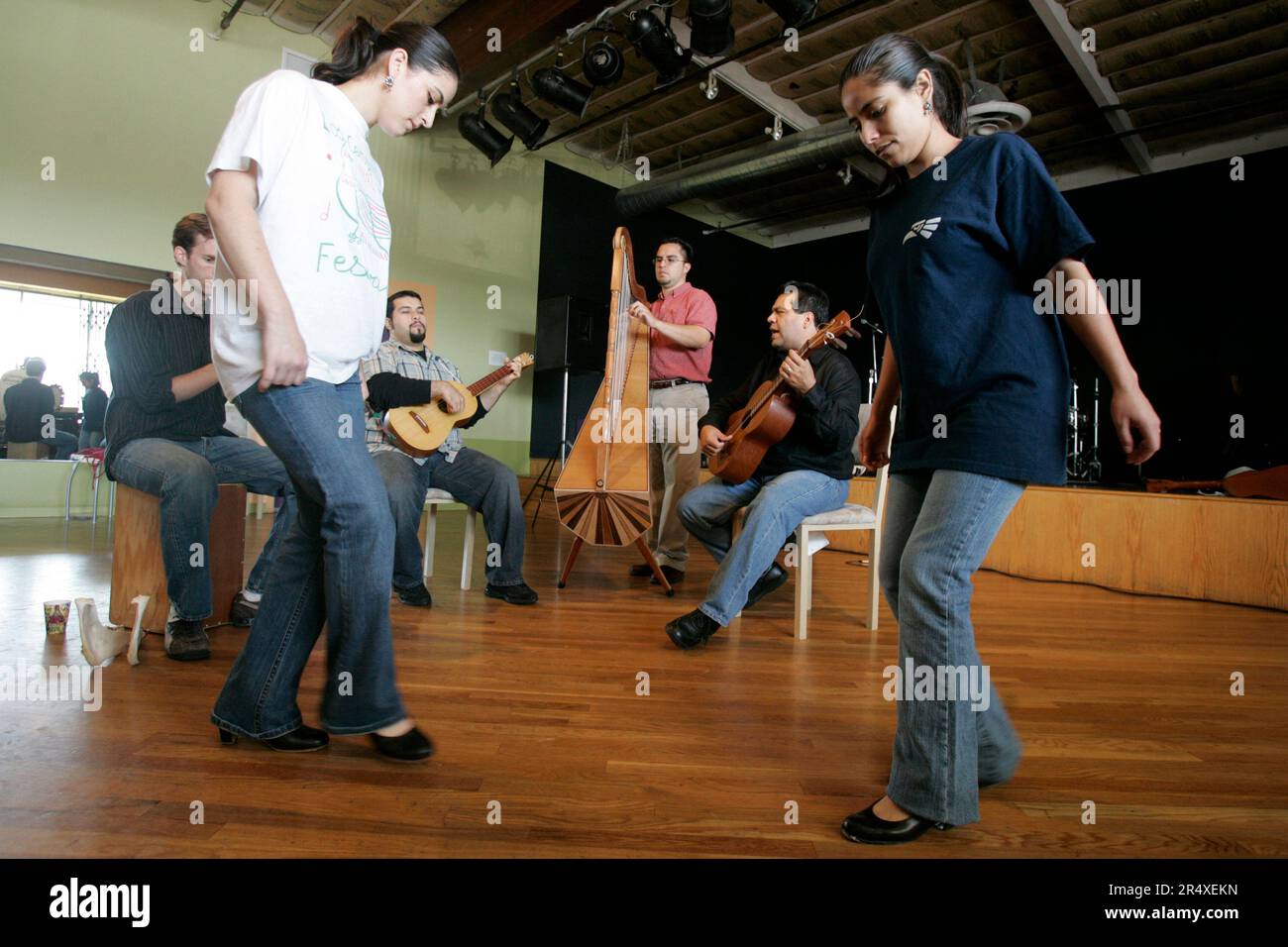 Fabiola Trujillo (left) and Lucina Rodriguez dance as Eugene Rodriguez ...