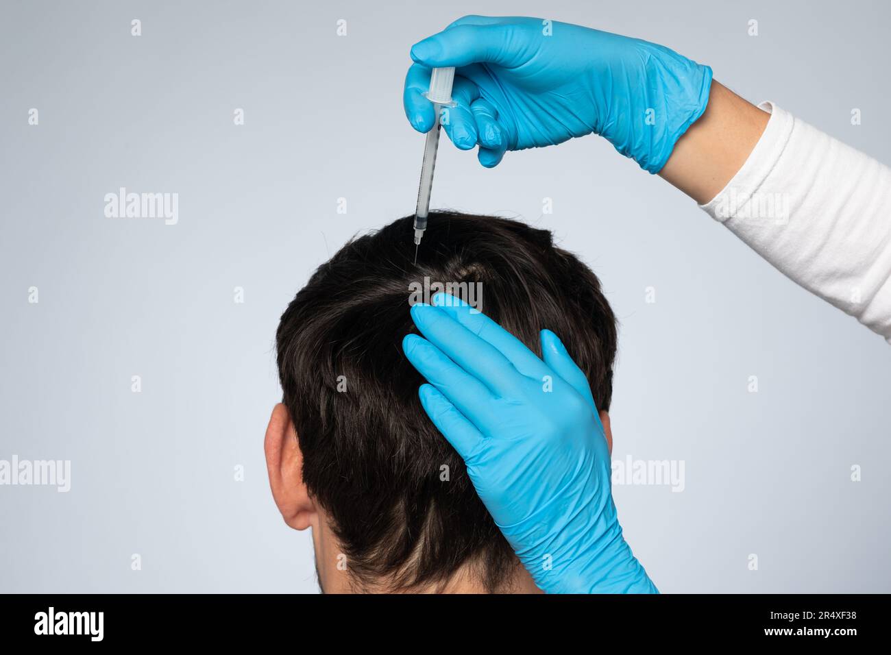 Mesotherapy concept. Man receiving injections in his head, having ...