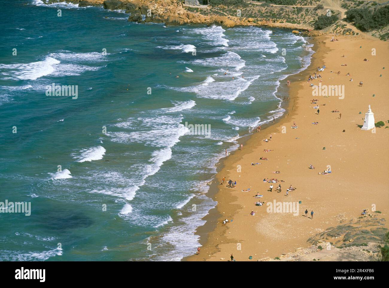 Aerial view of a beach with sunbathers; Gozo Island, Republic of Malta ...