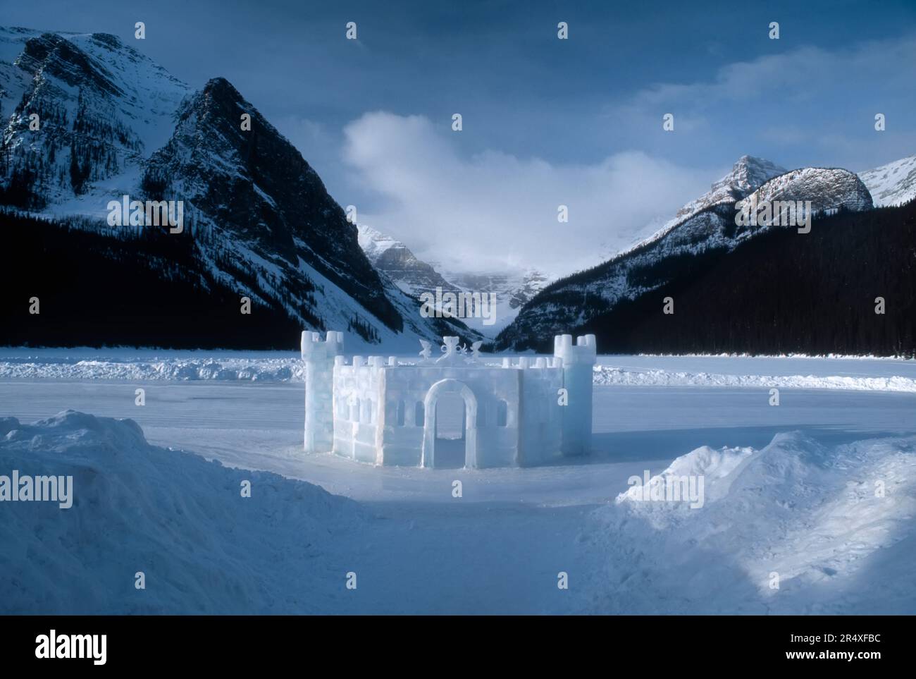 Ice castle on Lake Louise with mountains on far shore in Banff National ...