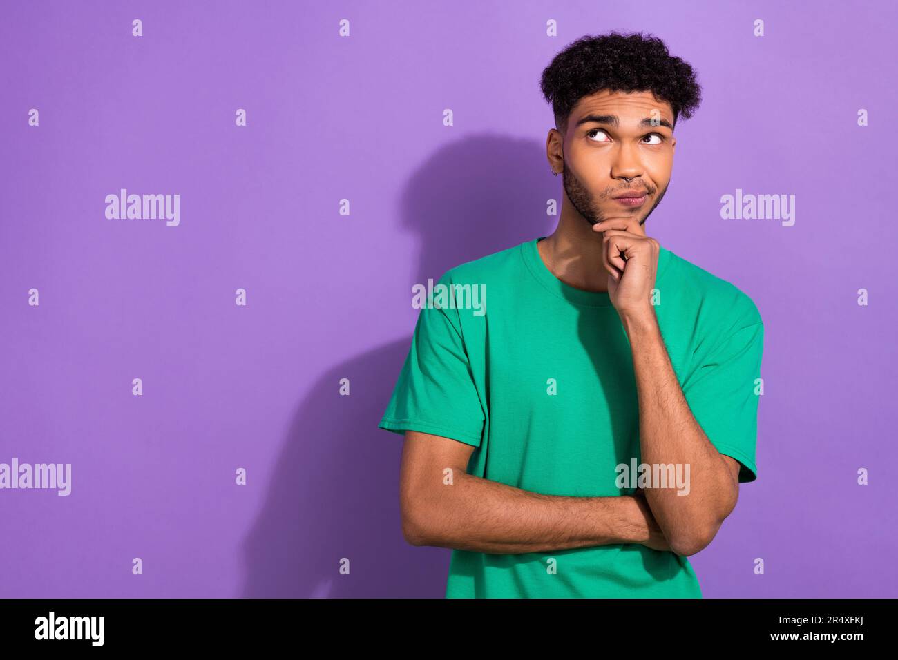 Photo of youngster man crossed arms minded pensive contemplated face ...