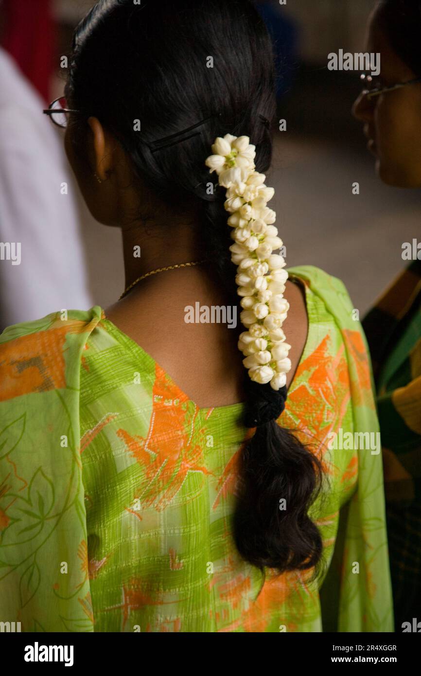 Woman with jasmine flowers in her hair at the Meenakshi Temple; Madurai ...