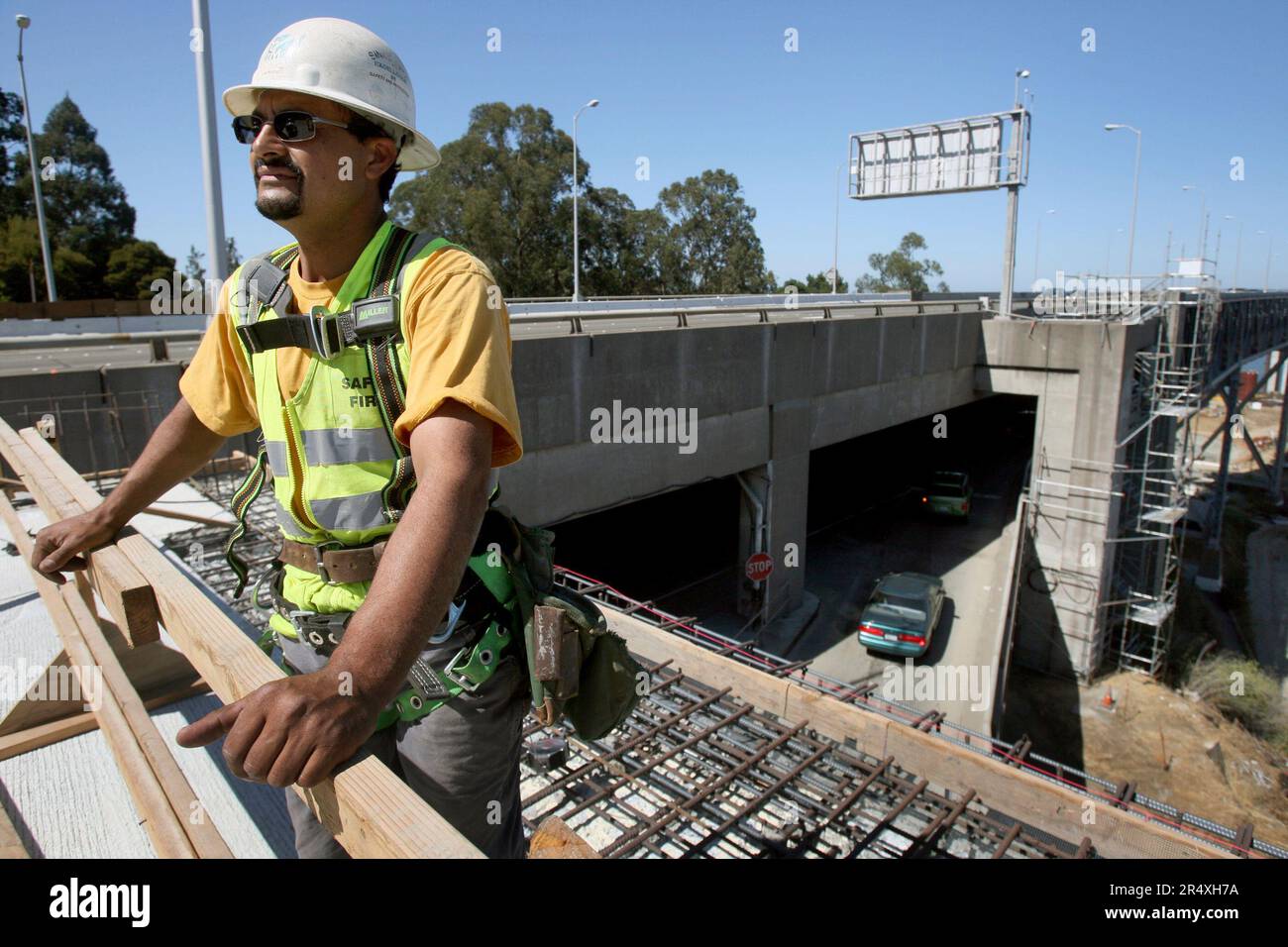 Sam Brenes admires the view while construction workers make final ...