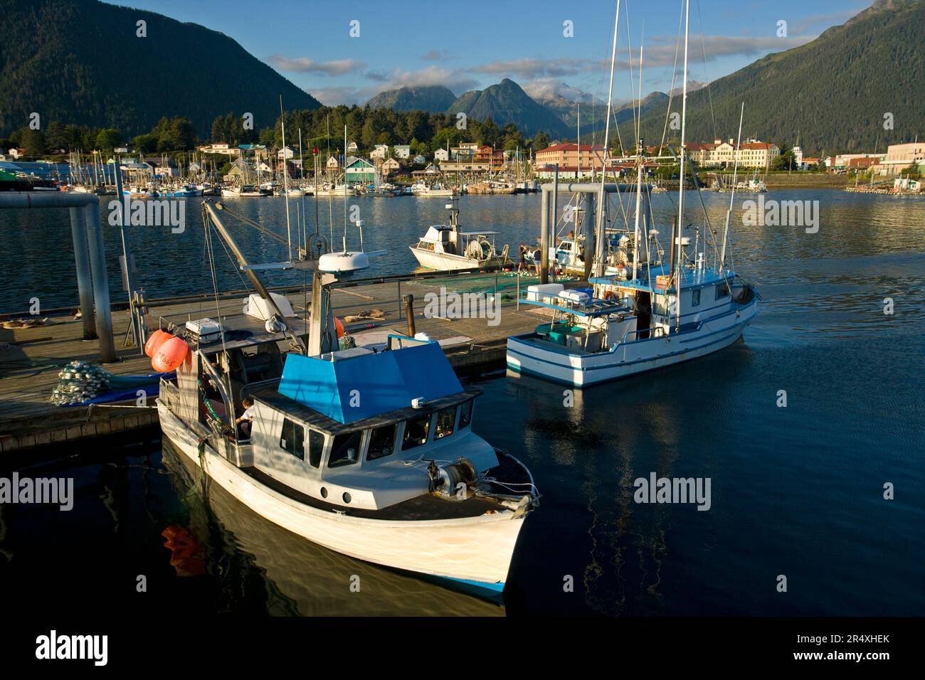 Boats docked along the shoreline at Sitka, Alaska, USA; Sitka, Alaska ...