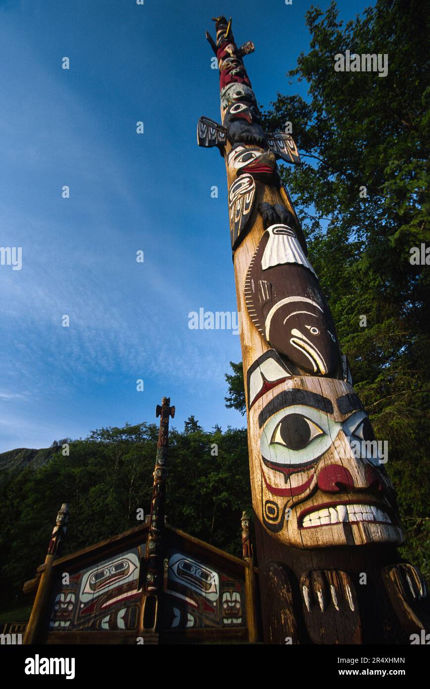 Totem pole and clan house in Totem Bight State Park, Ketchikan, Alaska ...