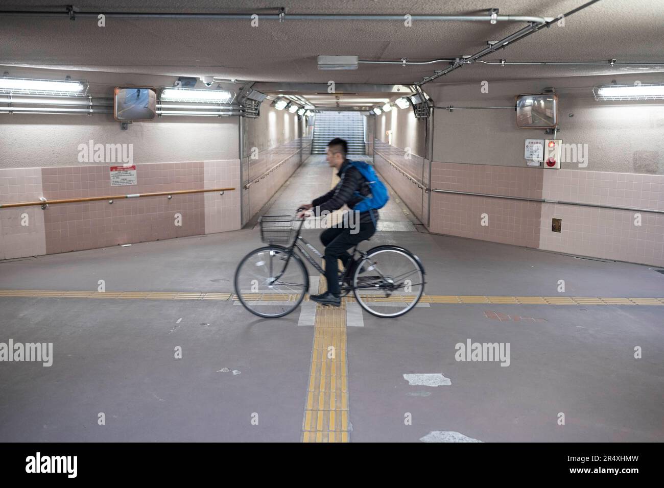 Hiroshima, Japan. 7th Mar, 2023. An underground bicycle cyclist pathway to cut under freeways ...