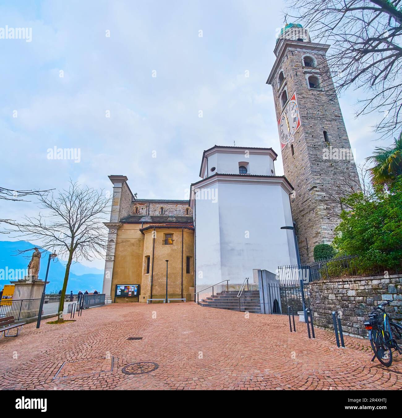Historic San Lorenzo Cathedral with tall stone clocktower, Lugano ...