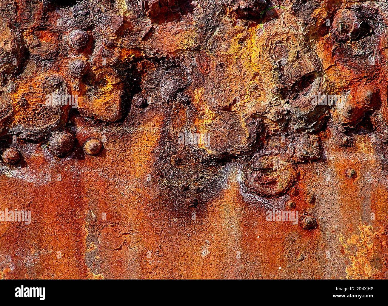 Bright vivid colours created by the rusting of the old steel plates of ...