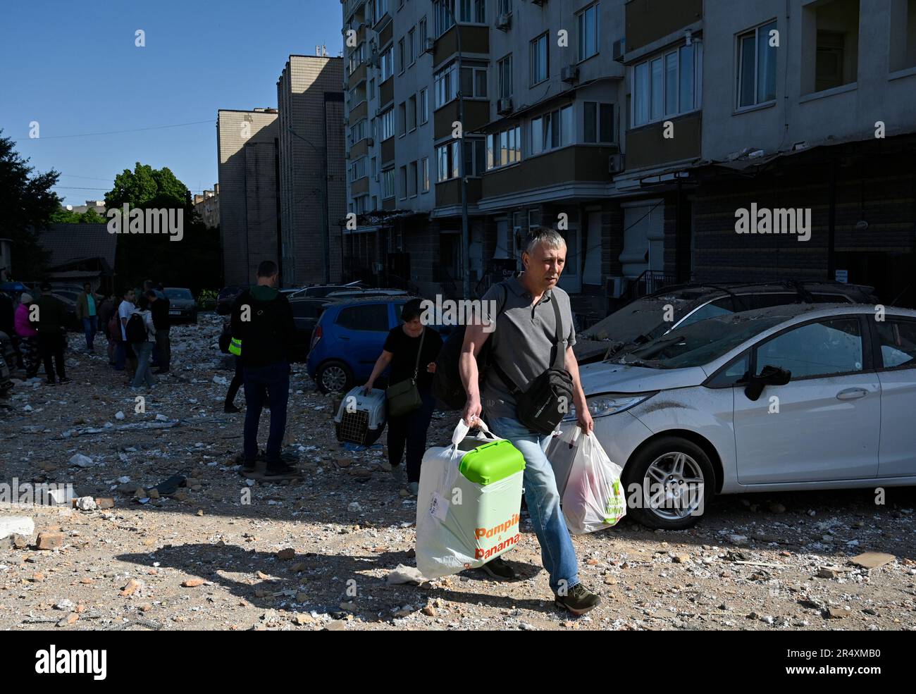 Kyiv, Ukraine. 30th May, 2023. People walk past multi-storey ...
