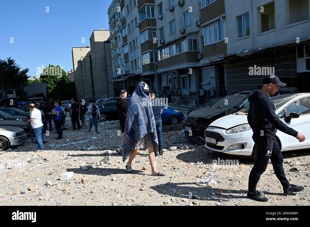 Kyiv, Ukraine. 30th May, 2023. People walk past multi-storey ...
