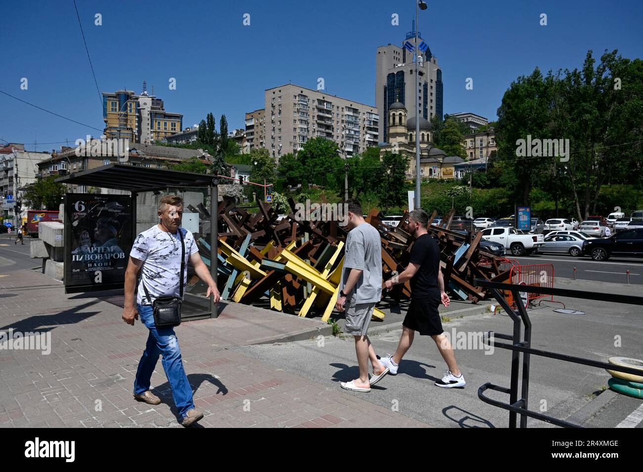 Kyiv, Ukraine. 30th May, 2023. People walk past anti-tank hedgehogs in ...