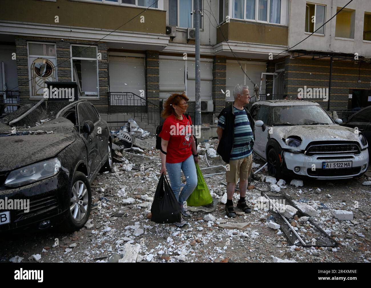 Kyiv, Ukraine. 30th May, 2023. People go near multi-storey residential ...