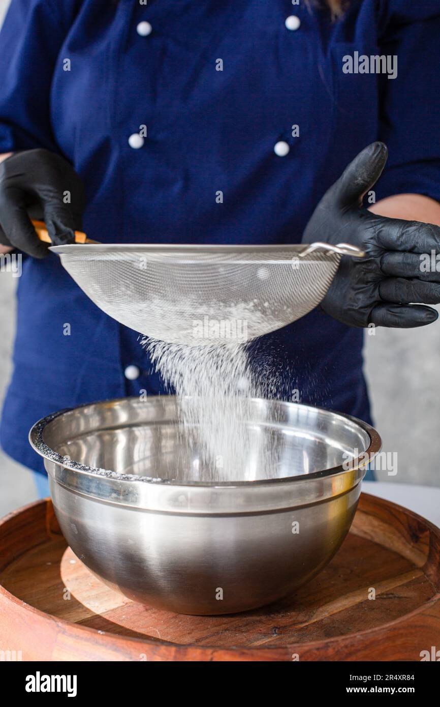 Sifting flour through sieve on hi-res stock photography and images - Alamy