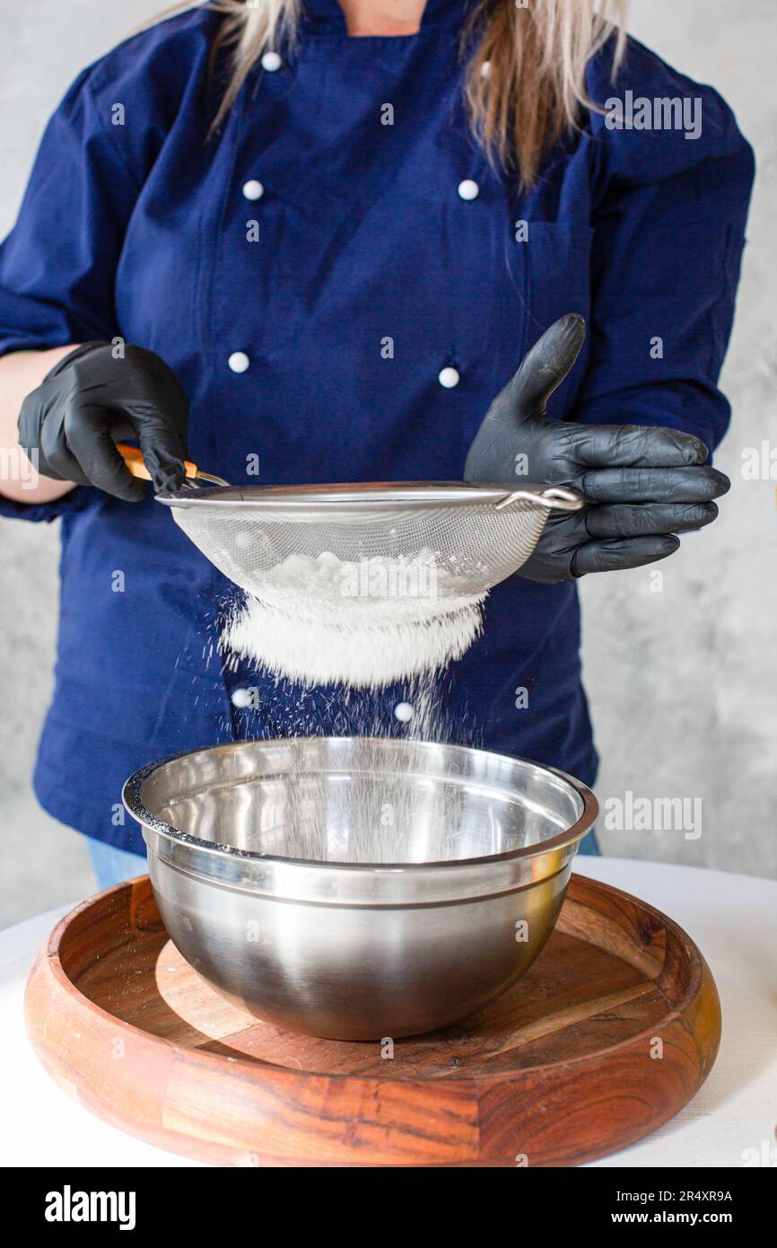 Sifting flour through sieve on hi-res stock photography and images - Alamy