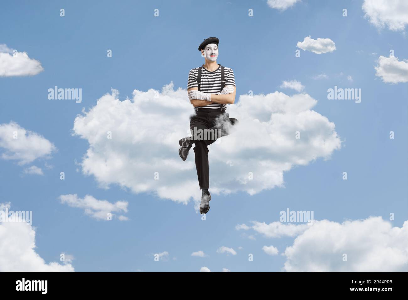 Full length portrait of a mime sitting on a cloud up in the sky Stock ...