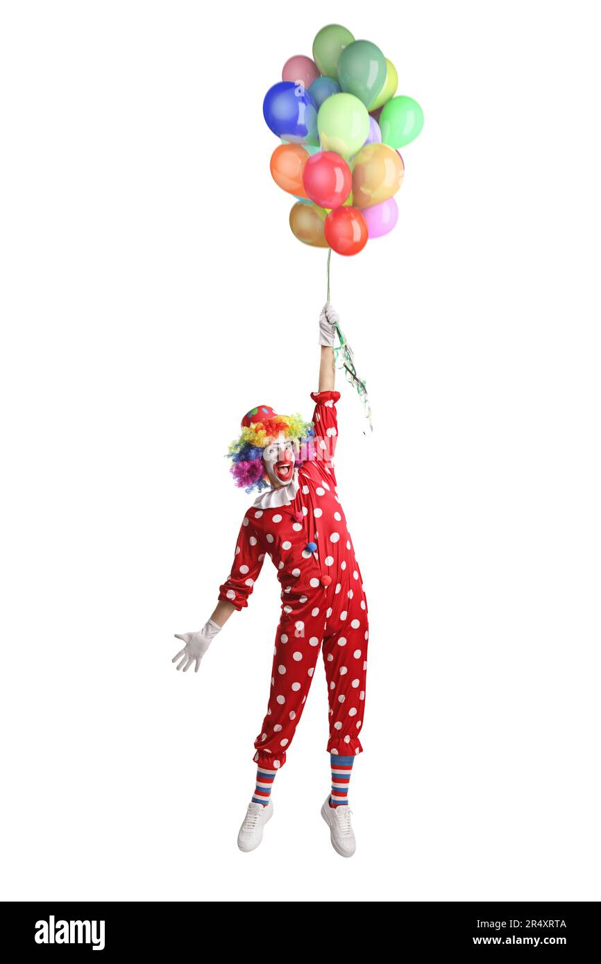 Clown flying and holding a bunch of balloons isolated on white ...