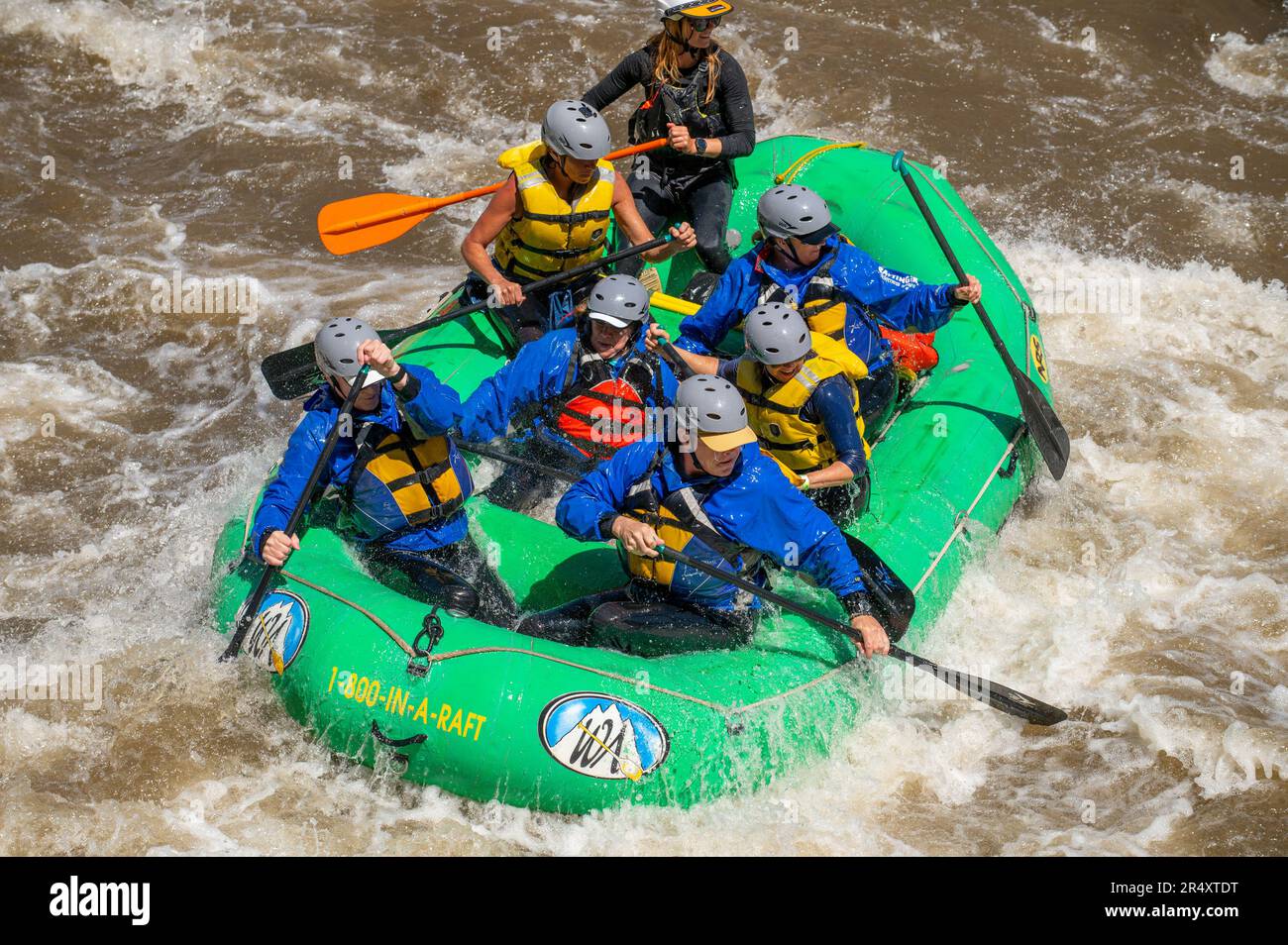 Truly adventure photograph of people taking on the rough water of the ...