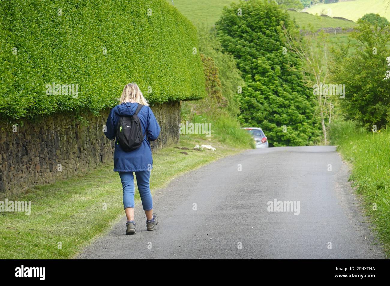 Lady walking in the countryside hi-res stock photography and images - Alamy