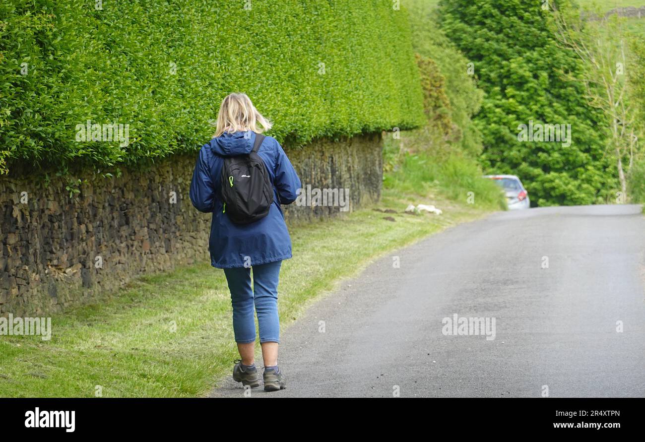 Lady walking in the countryside hi-res stock photography and images - Alamy