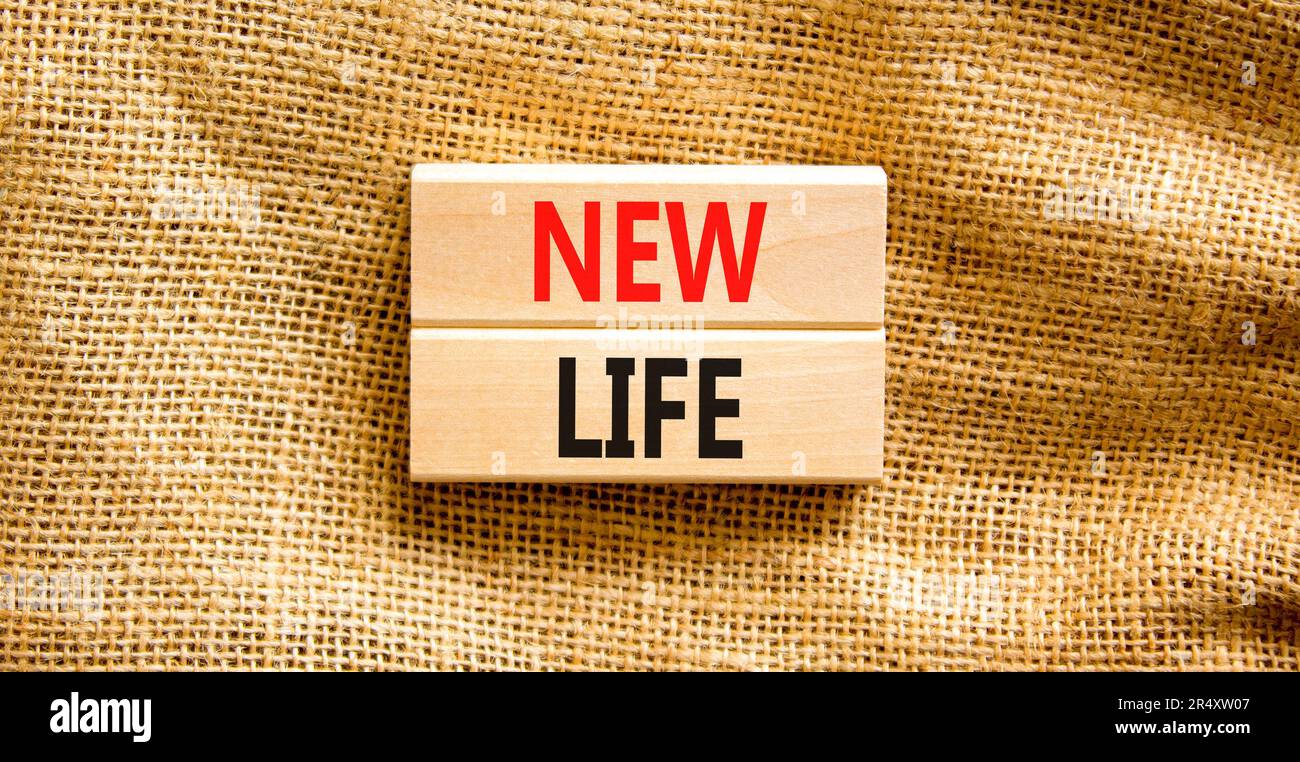 New life symbol. Concept words New life on wooden blocks on a beautiful ...