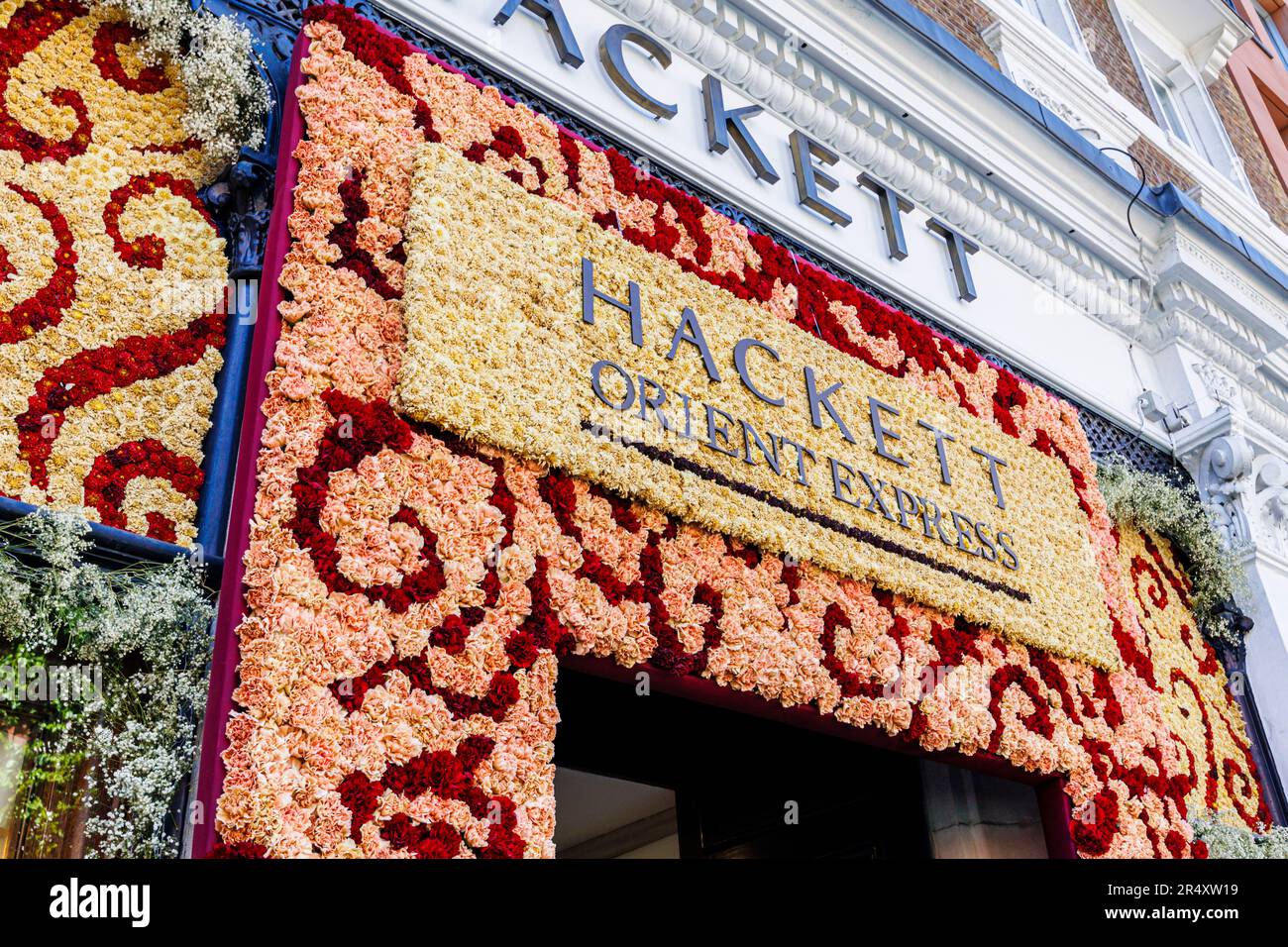 A floral display at the entrance of Hackett shop in Sloane Street near ...