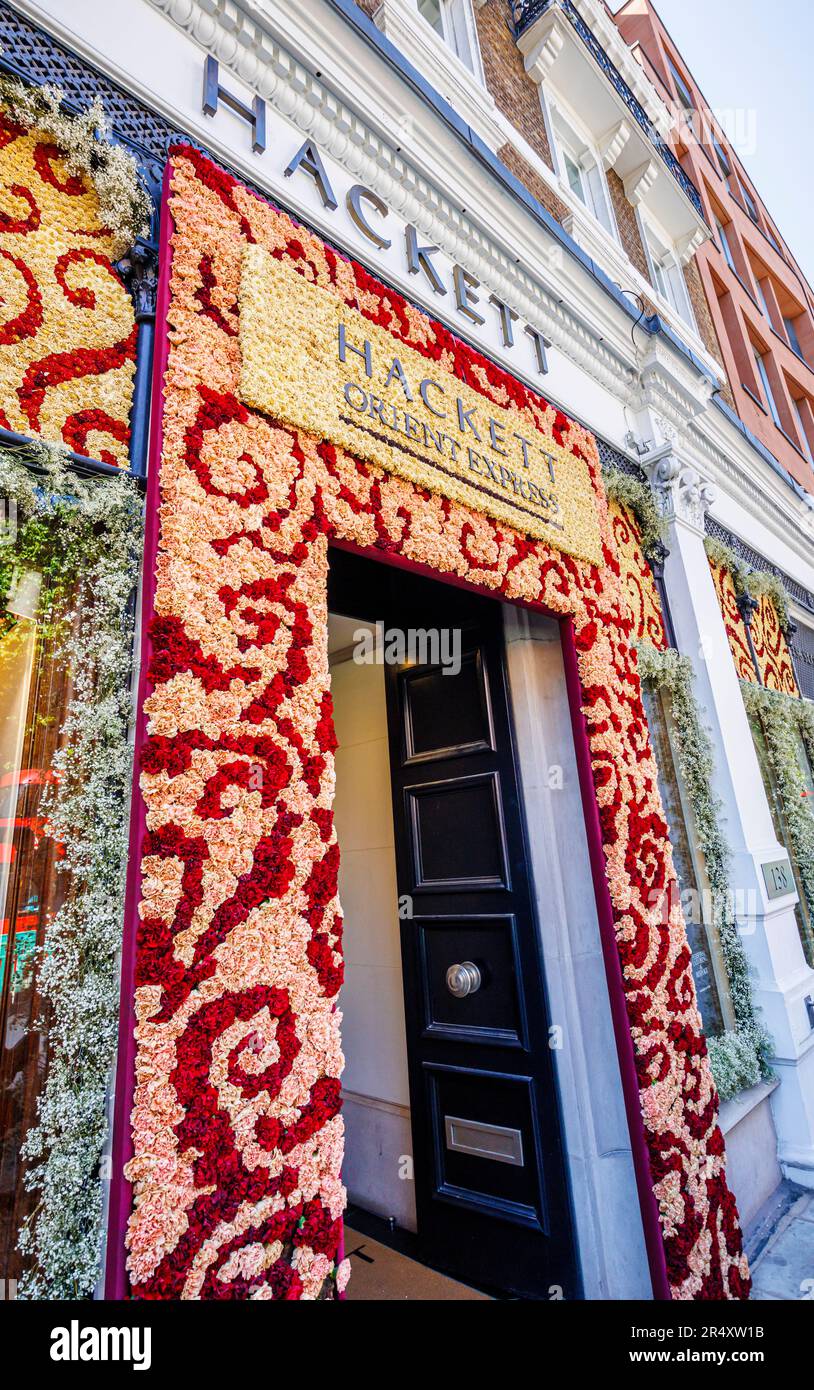 A floral display at the entrance of Hackett shop in Sloane Street near ...