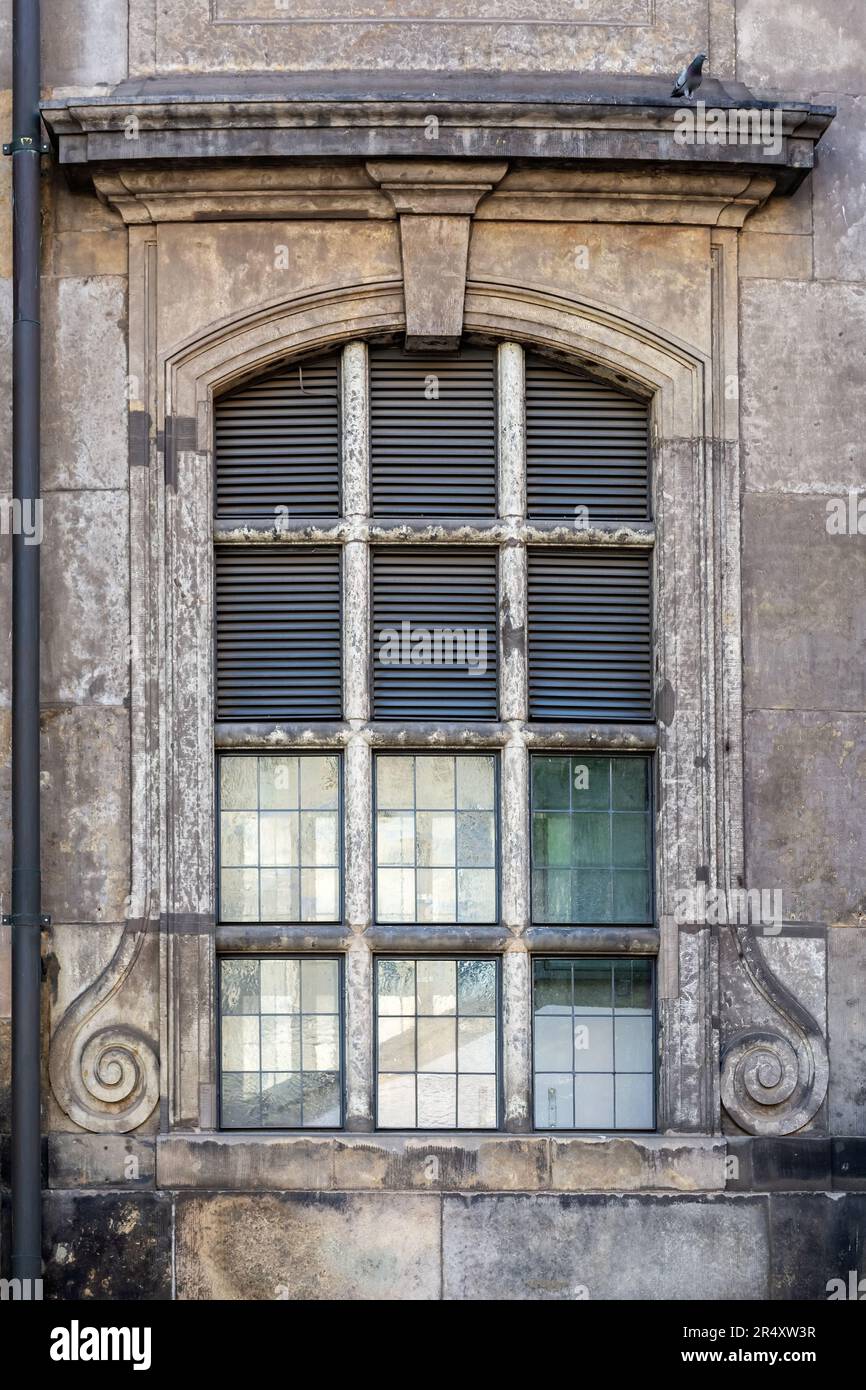 Rectangular cellular arched window with opaque glass against the ...