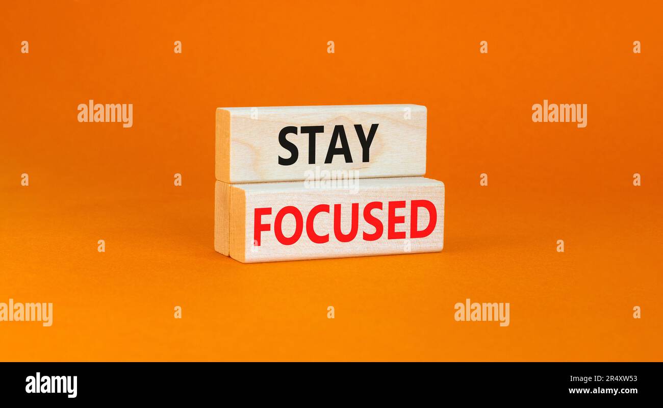 Stay focused symbol. Concept words Stay focused on wooden blocks on a ...
