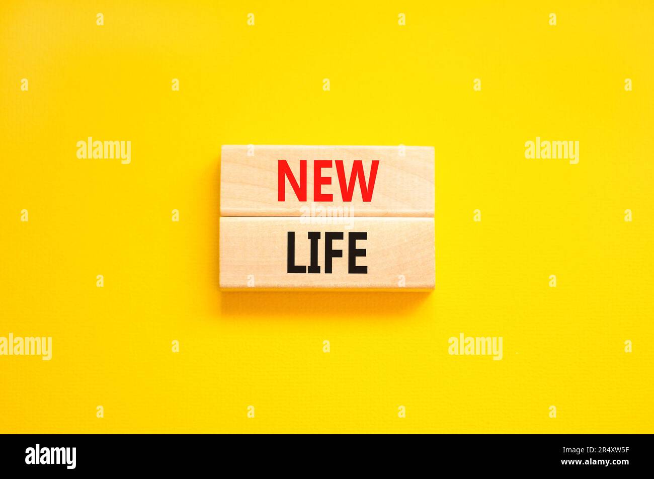 New life symbol. Concept words New life on wooden blocks on a beautiful ...