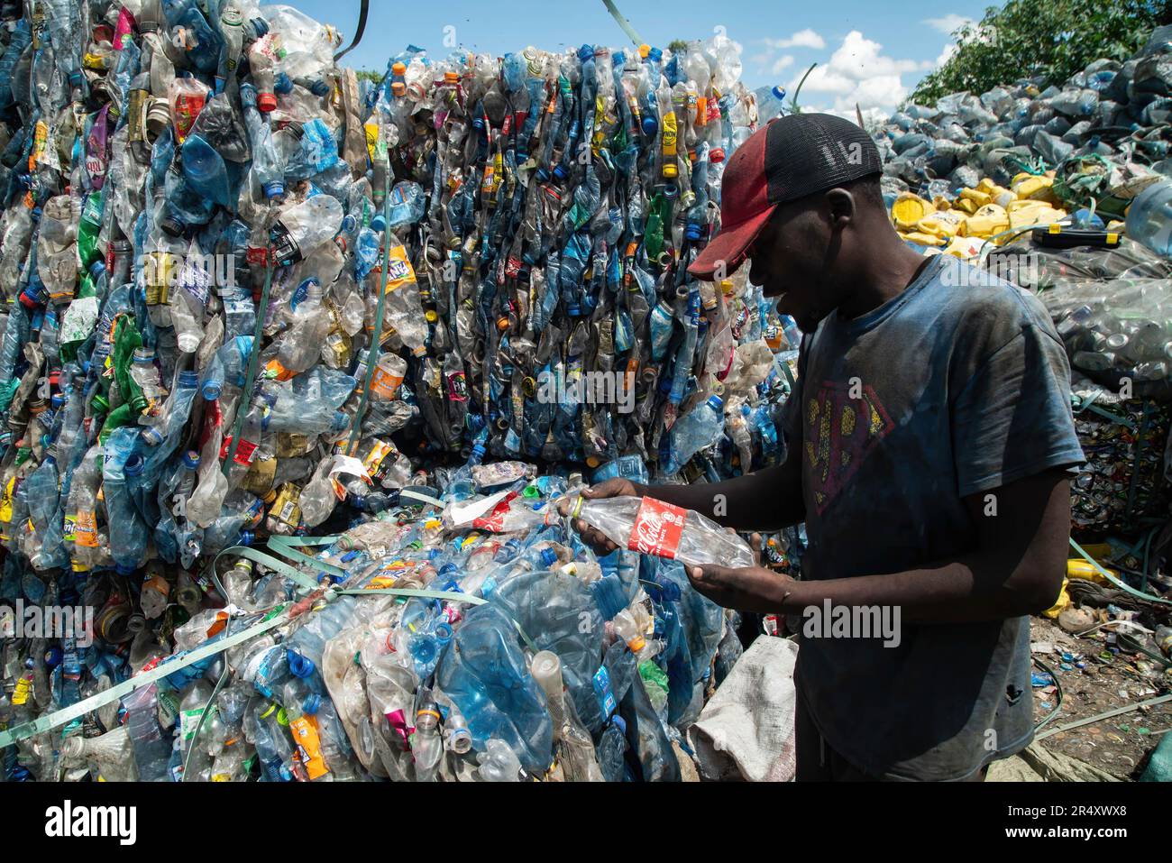 A worker is seen at a recycling plant in Nakuru. Negotiators have ...
