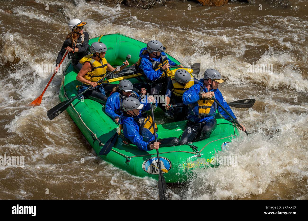 Truly adventure photograph of people taking on the rough water of the ...