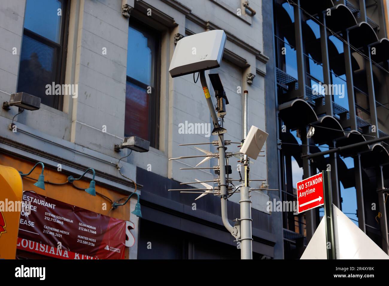 A MTA NYC Transit outdoor wireless antenna array on a sidewalk outside ...