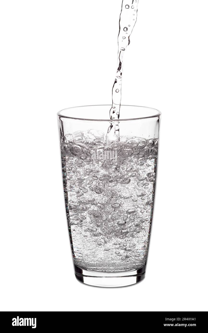 Carbonated water pouring to glass on white background Stock Photo - Alamy