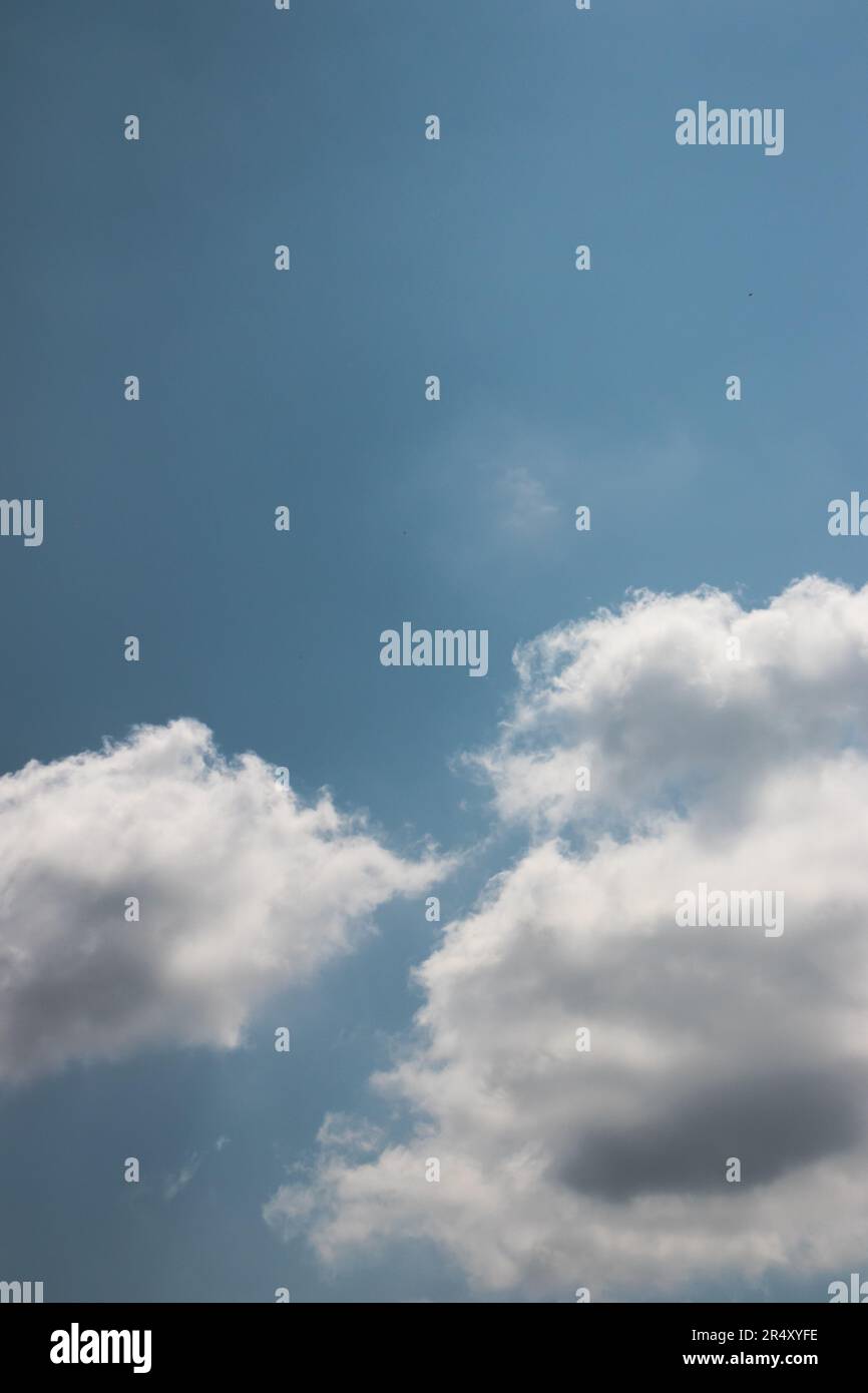 A dreamy sky of white fluffy clouds, a clear blue atmosphere and ...