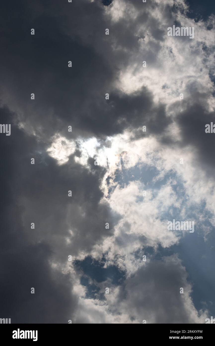 A dramatic sky with cloudscape and sunlight breaking through an ...