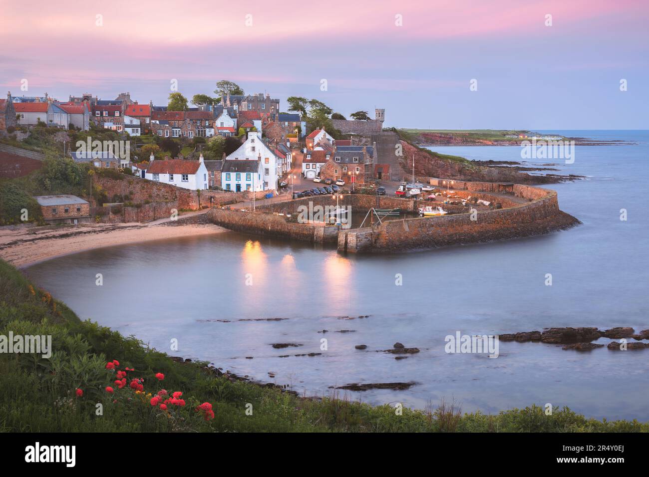Scenic, picturesque sunset view of the charming coastal fishing village ...